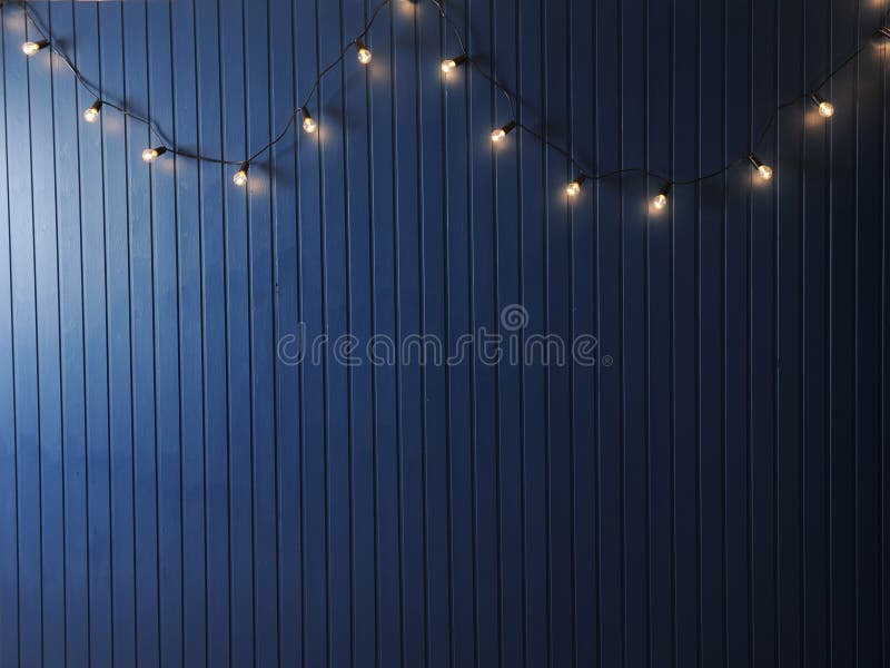 Blue Wall with Retro Garland of Light Bulbs. Texture for the Design ...