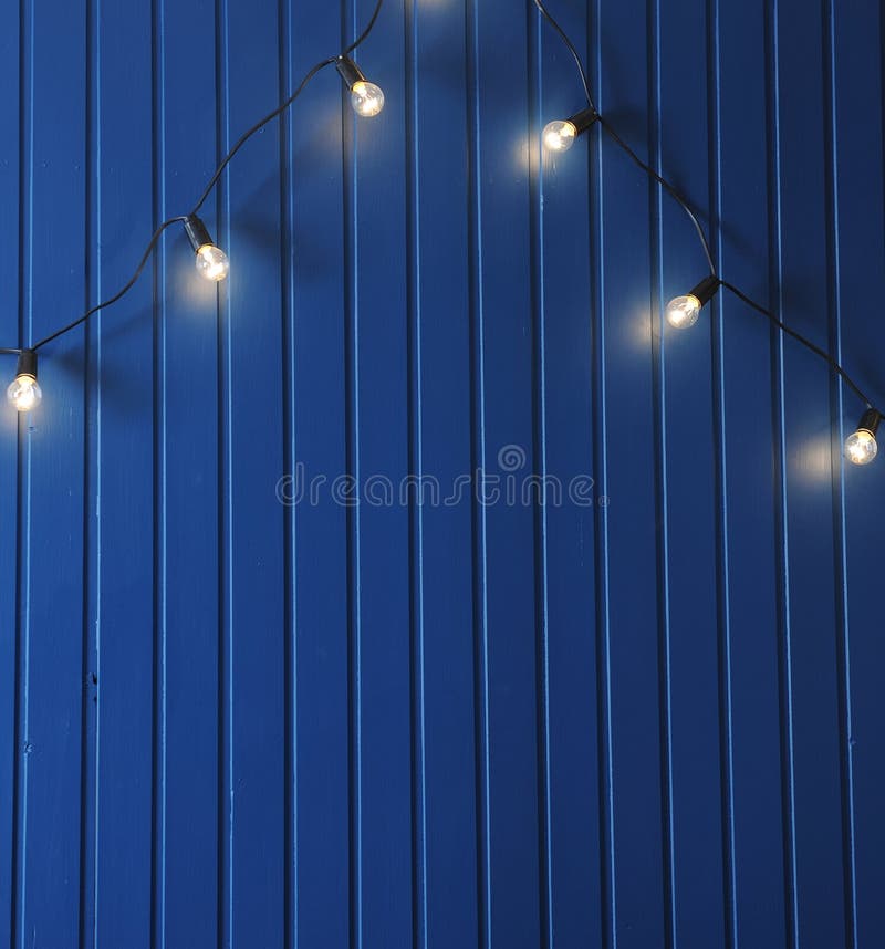 Blue Wall with Retro Garland of Light Bulbs. Texture for the Design ...