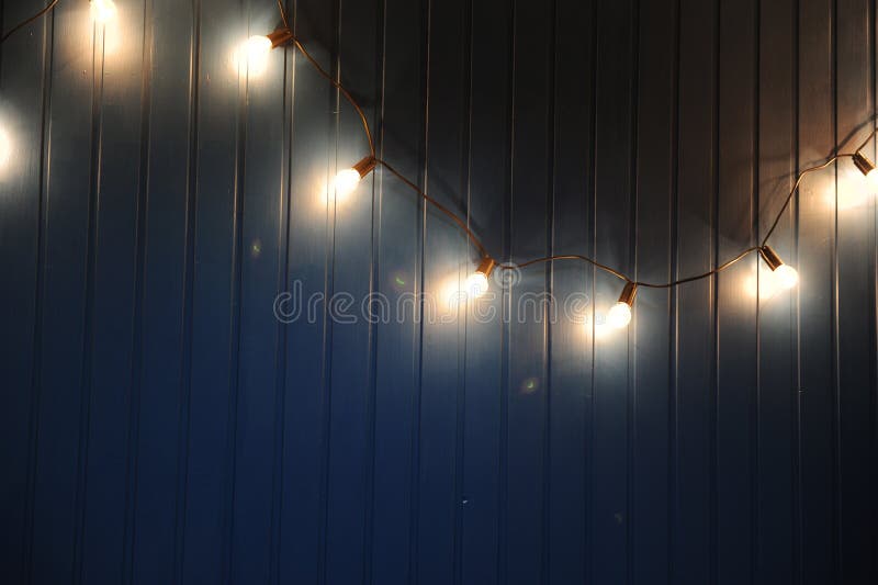 Blue Wall with Retro Garland of Light Bulbs. Texture for the Design ...