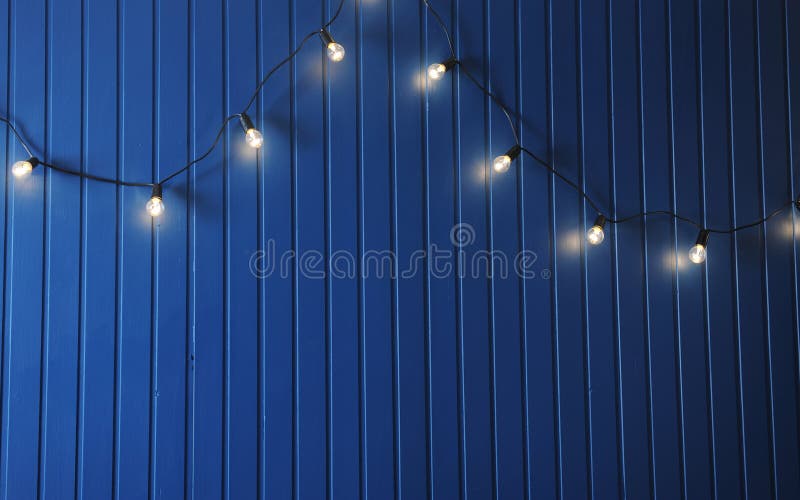 Blue Wall with Retro Garland of Light Bulbs. Texture for the Design ...