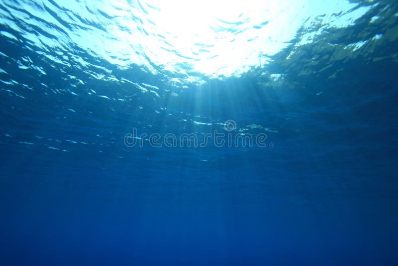 Sun rays in blue water stock photo. Image of texture - 15075914
