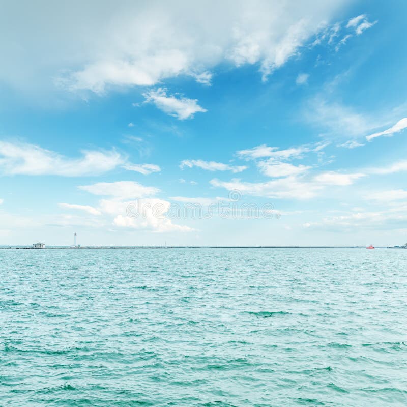 Blue water and cloudy sky stock image. Image of horizon - 41688985