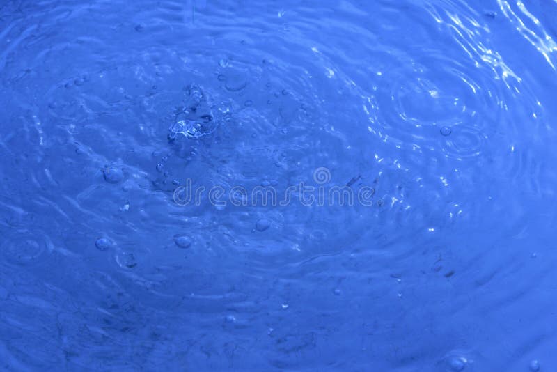 Blue Water Dripping - Splash Droplets with Small Waves Stock Image ...