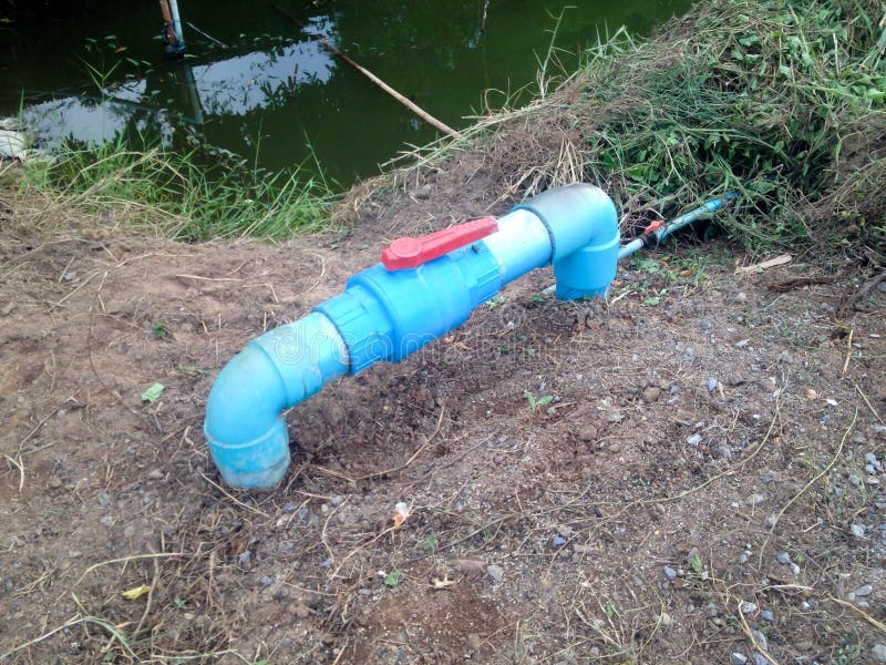 A Blue Water Pipe Valve Near Canal Stock Photo - Image of metal, main ...