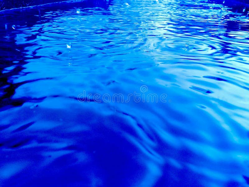 Blue water pond at rain stock photo. Image of rain, pond - 186860338