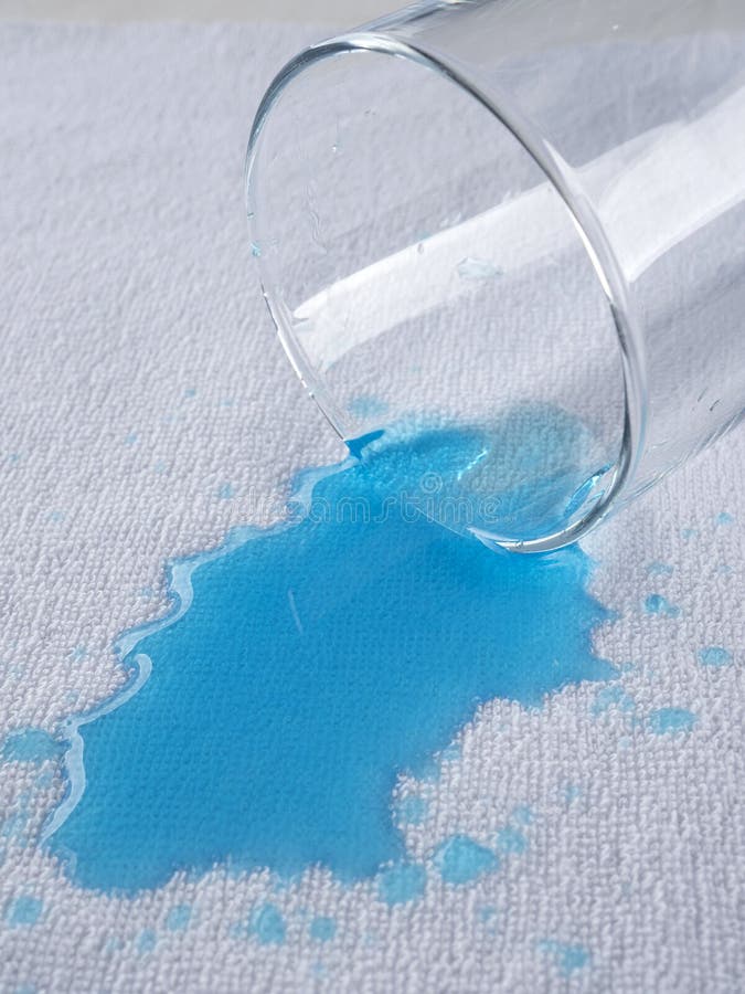 Blue Water Pours from a Glass Onto a Waterproof Cloth Stock Photo ...
