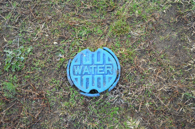 Blue Water Sign and Access Panel with Green Grass or Lawn Stock Image ...