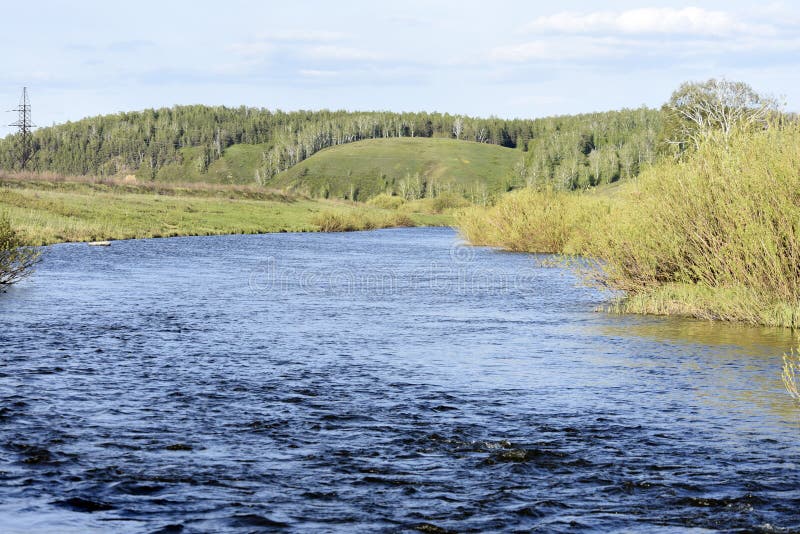 The Blue Water of the Spring River Against the Background of Green ...