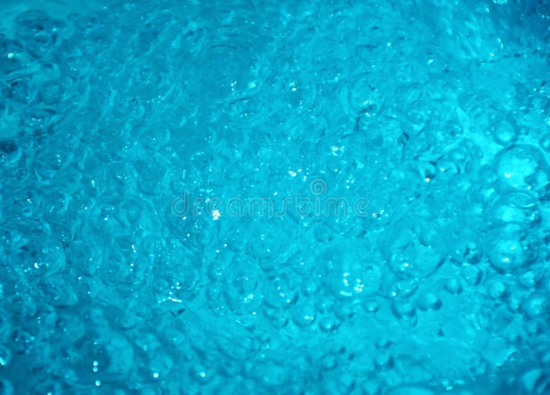 The Blue Water Surface Bubbling into a Beautiful Grain Stock Photo ...
