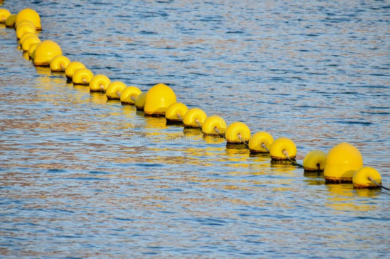 Yellow Floaters stock photo. Image of unlit, boat, bray - 32189524