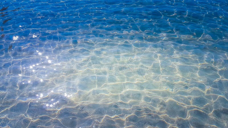 Blue Water Wave with Shining White Twinkling from the Sun Stock Photo ...