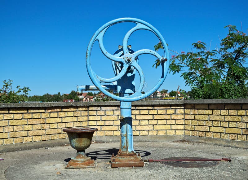 Blue Water Well Pump, with Wheel, on Summer Sun Stock Photo - Image of ...