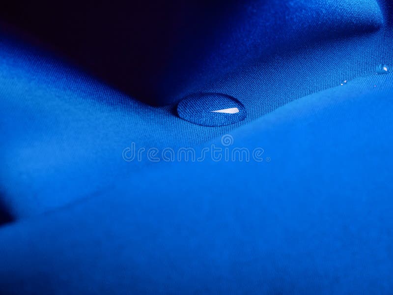 Blue Waterproof Fabric with Drop of Rain Close Up Stock Image - Image ...
