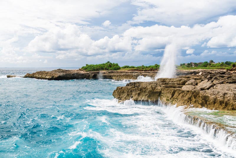Blue Waves Breaking on the Rocks Stock Photo - Image of summer, bali ...
