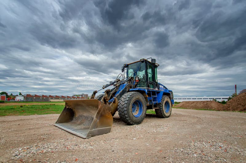 Blue Wheel Loader on a Construction Site, Mining Editorial Image ...