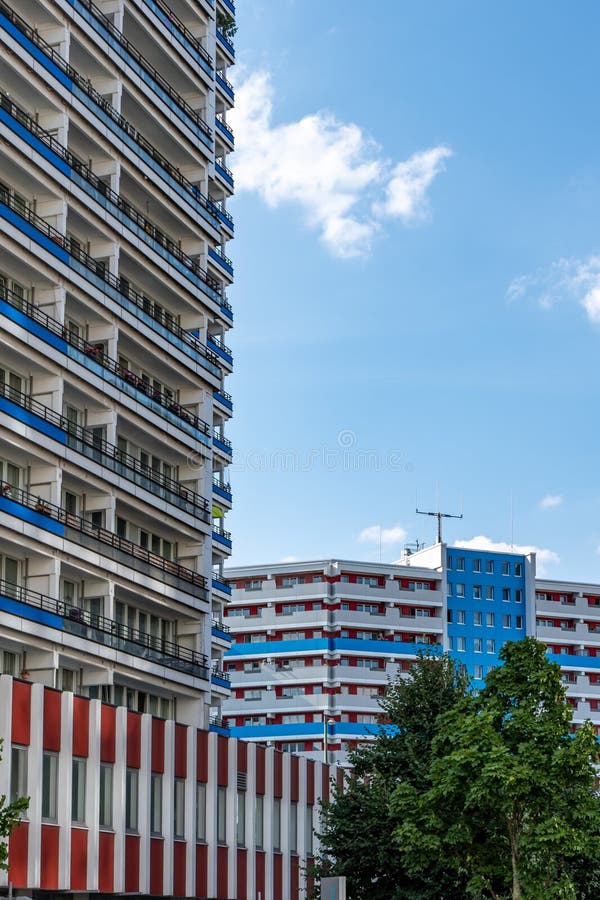 A Blue and White Building is Next To a Red and White Building Stock ...