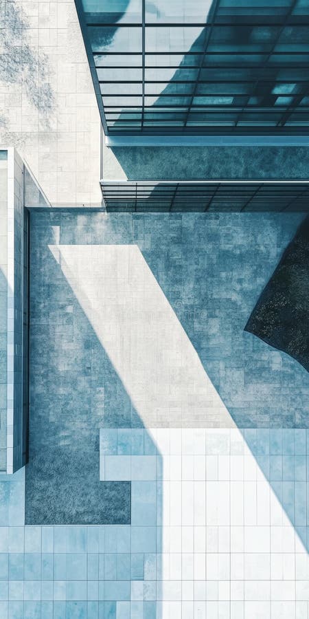 A Blue and White Building with a Shadow on the Ground Stock ...