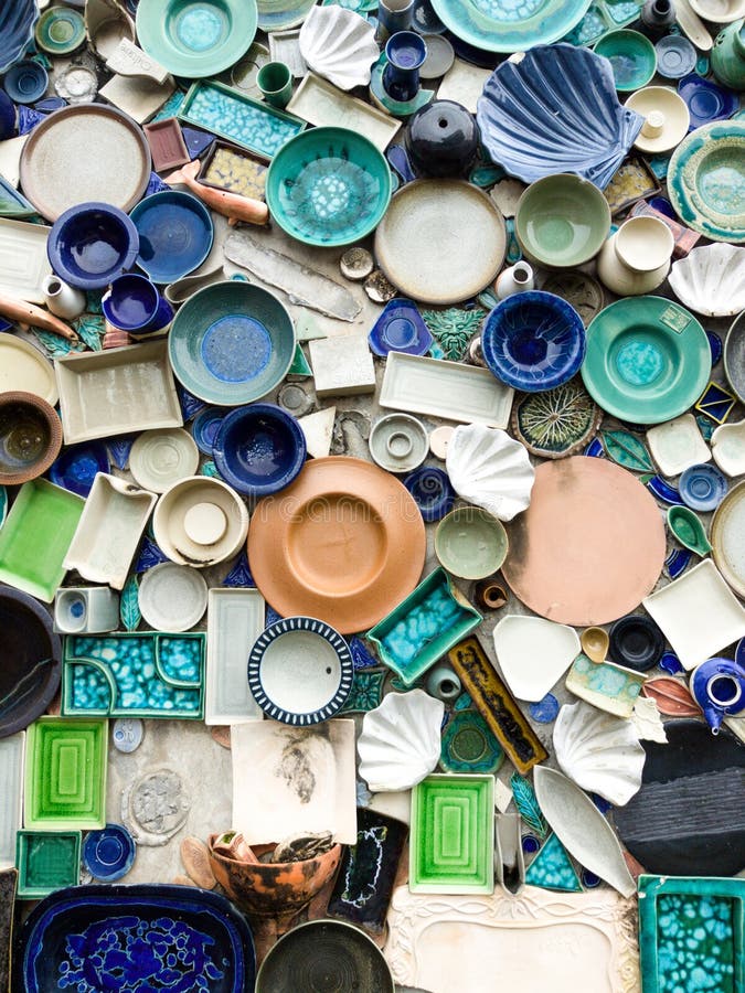 Different Colorful Ceramic Plates on the Orange Wall Stock Photo ...