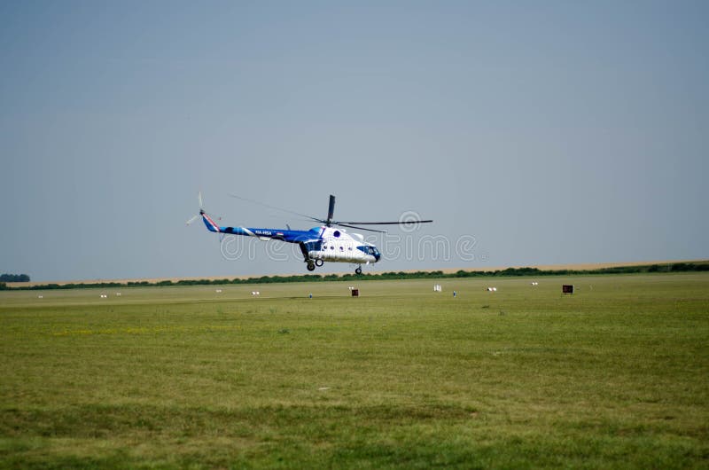 Blue-white Civil Helicopter Soars from the Airfield Stock Photo - Image ...