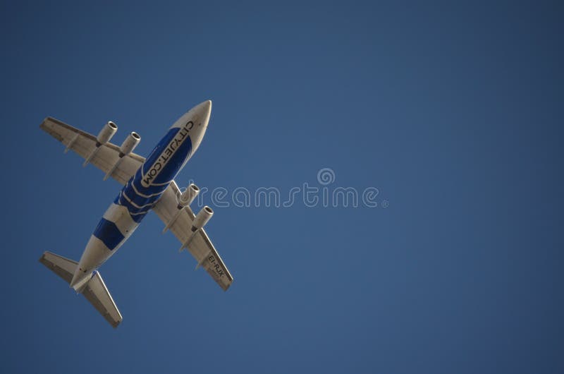 Blue and White Commercial Airplane Flying Upwards Editorial Image ...