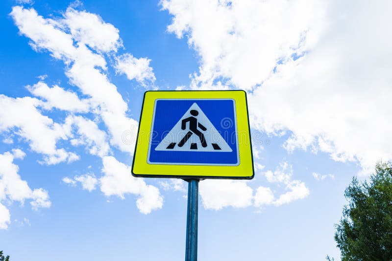 Blue and White Pedestrian Crossing Sign on the Sky Background Stock ...