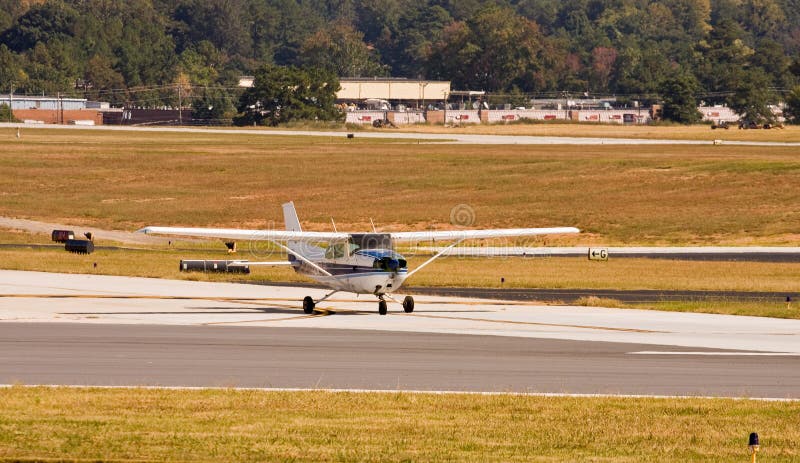Blue and White Prop Plane on Runway Stock Photo - Image of airplane ...