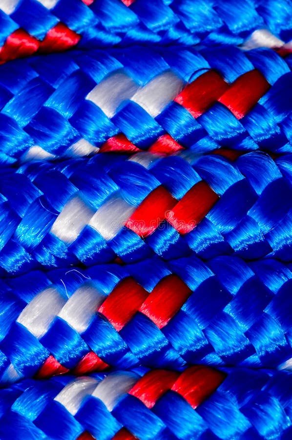 A Blue, White and Red Rope with a Red Stripe Stock Image - Image of ...