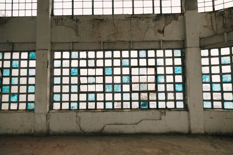 Square Windows and a Kettle Inside an Old Abandoned Industrial Building ...