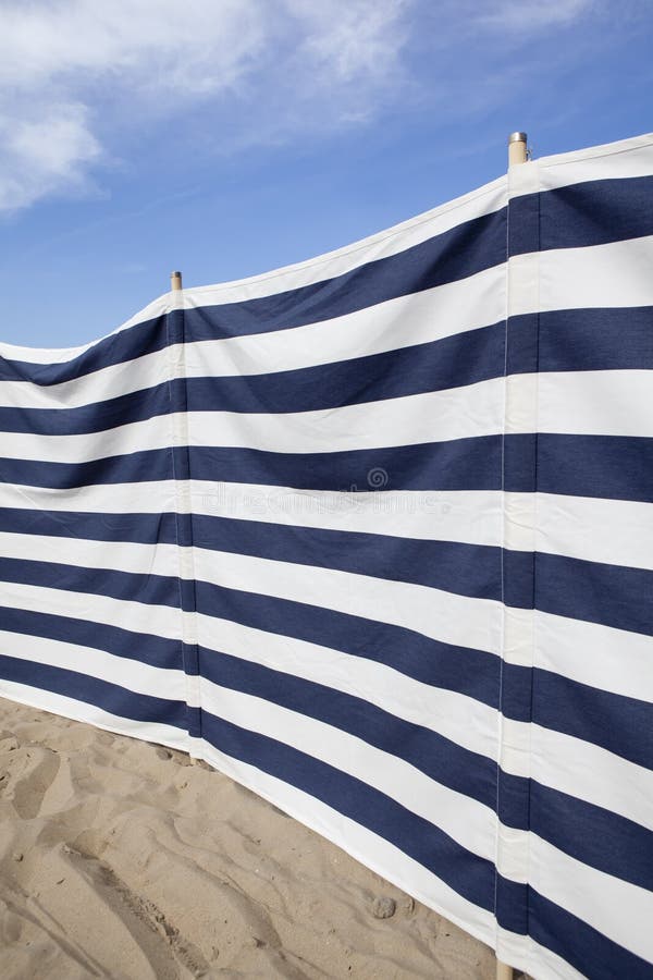Blue and White Striped Windbreak at the Beach Stock Photo - Image of ...