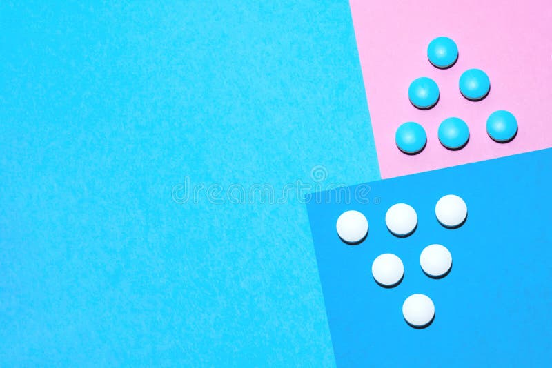 Blue and White Tablets Laid Out in the Form of an Arrow on a Paper ...