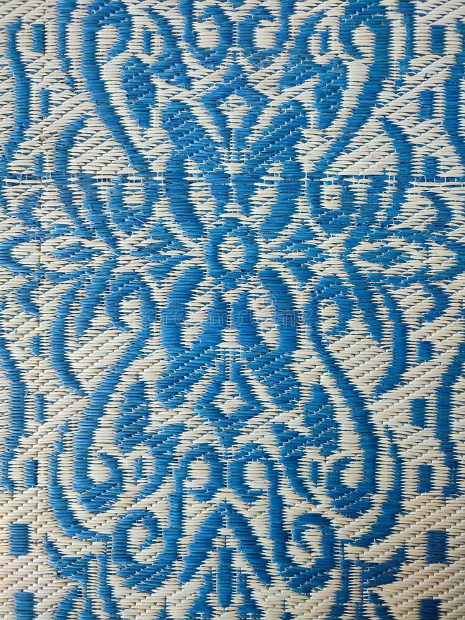 Blue and White Woven Mat with Motif Designs on it Stock Image - Image ...