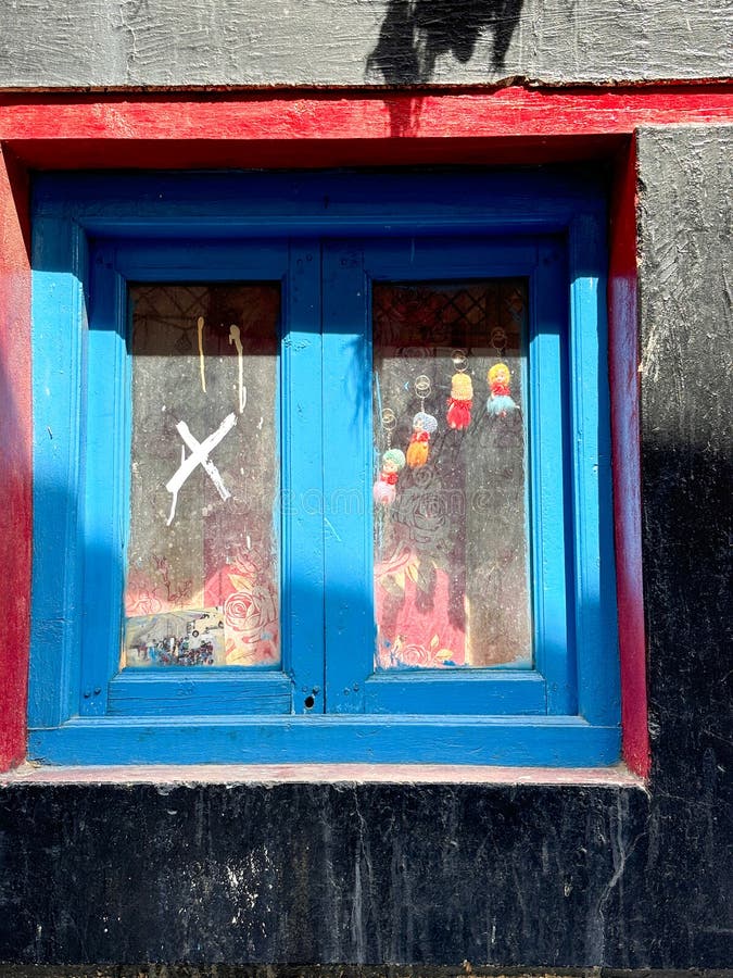 A Blue Window with a Red Border and a White X Painted on it, Spiti ...