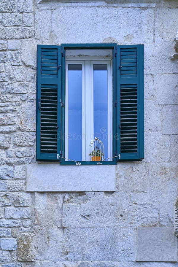 Blue Window in a Stone Wall Stock Photo - Image of flower, residential ...