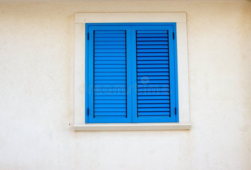 Blue window and white wall stock image. Image of exterior - 146743077