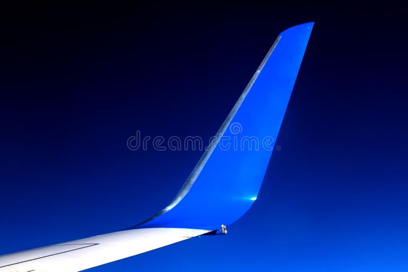 The Blue Winglet on a Wing of Plane Stock Image - Image of background ...