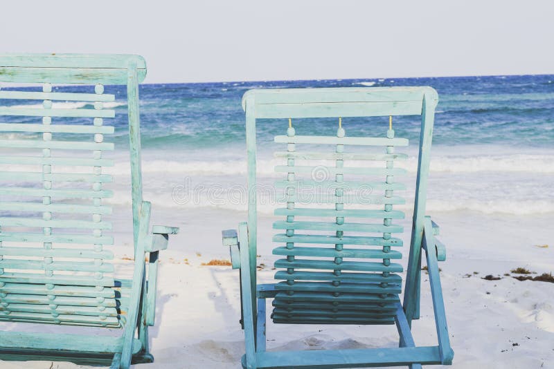 Blue wooden beach chairs stock image. Image of summer - 156337485
