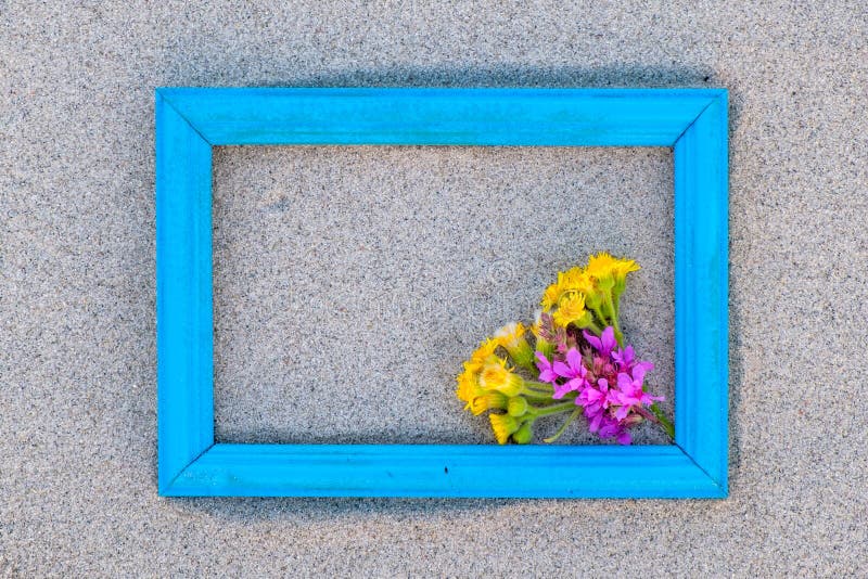 Blue Wooden Frame on Sand Inside Flowers Frame Stock Image - Image of ...