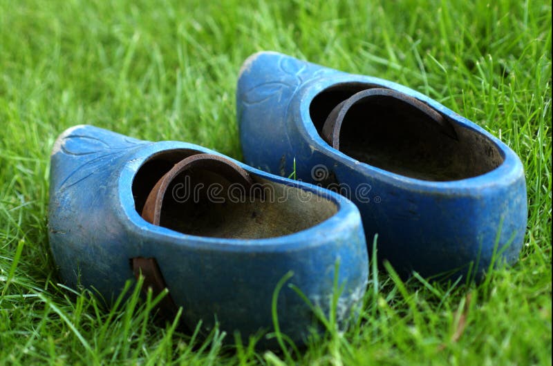 A Pair of Dutch Wooden Shoes in the Autumn Leaves Stock Image - Image ...