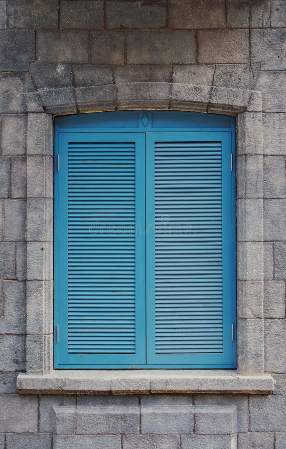 Blue Wooden Shutters on Rustic Stone Wall. Stock Image - Image of front ...