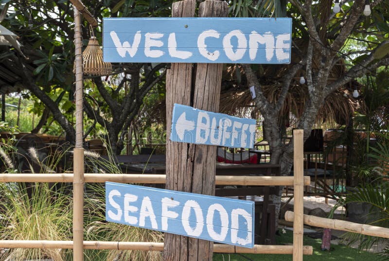 Blue Wooden Sign with a Message Welcome ,Buffet and Seafood Stock Photo ...