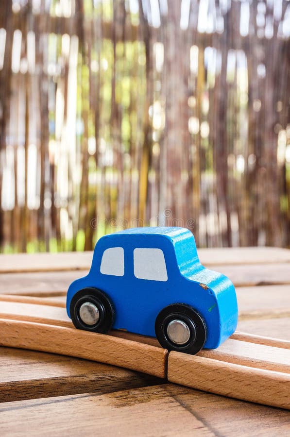 Blue Wooden Toy Car on Tracks on a Wooden Surface Stock Image - Image ...