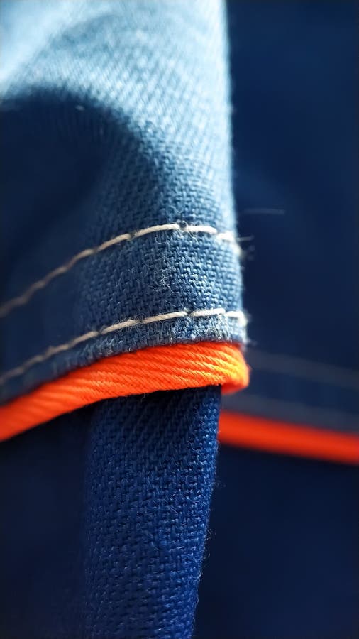 Blue Work Uniform Clothes with an Orange Stripe Macro Stock Photo ...