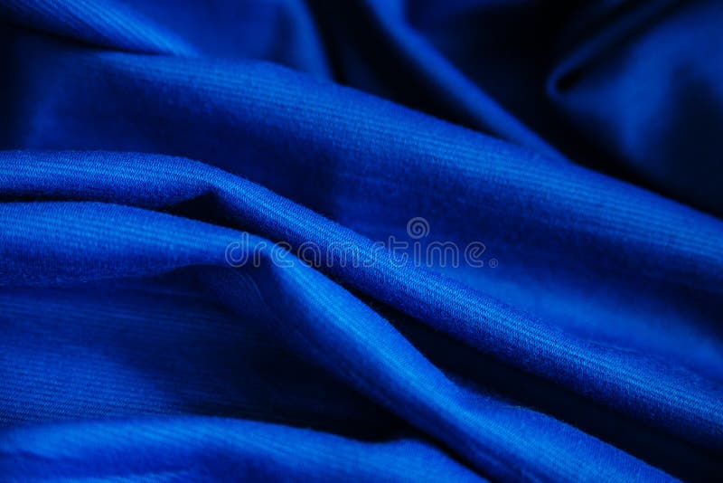 Blue Wrinkled Draped Fabric. Sewing Material is on the Table Stock ...
