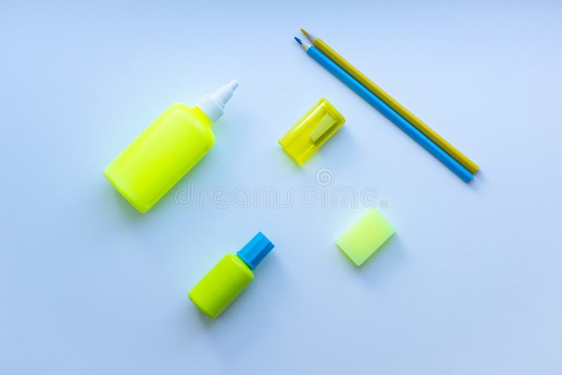 Top View of Mixed Stationery in Yellow and Blue Colours: Glue ...