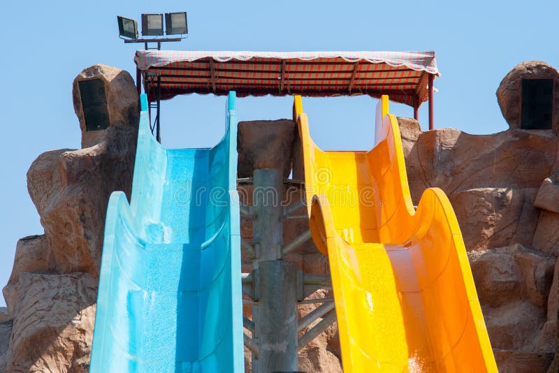 Blue and Yellow Aquapark Slides Stock Photo - Image of blue, curved ...