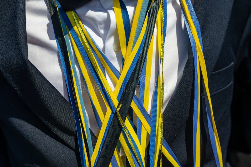 Blue and Yellow Bands Hanging Around the Neck of a Student.. Stock ...
