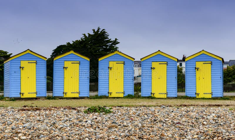 Blue and Yellow Beach Huts stock photo. Image of yellow - 28118622