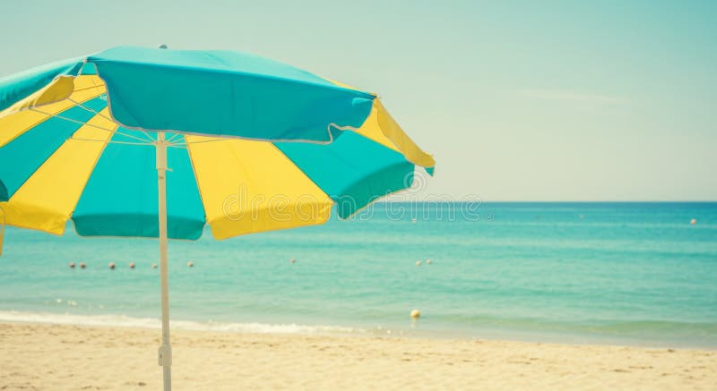 Blue and Yellow Beach Umbrella on Sandy Shore Stock Illustration ...
