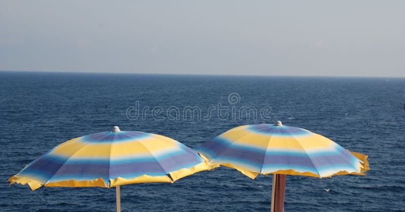 Blue and Yellow Beach Umbrellas Stock Photo - Image of holiday ...