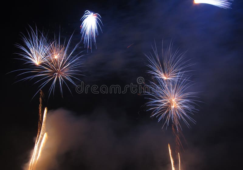 Blue and yellow fireworks stock photo. Image of year - 136015510